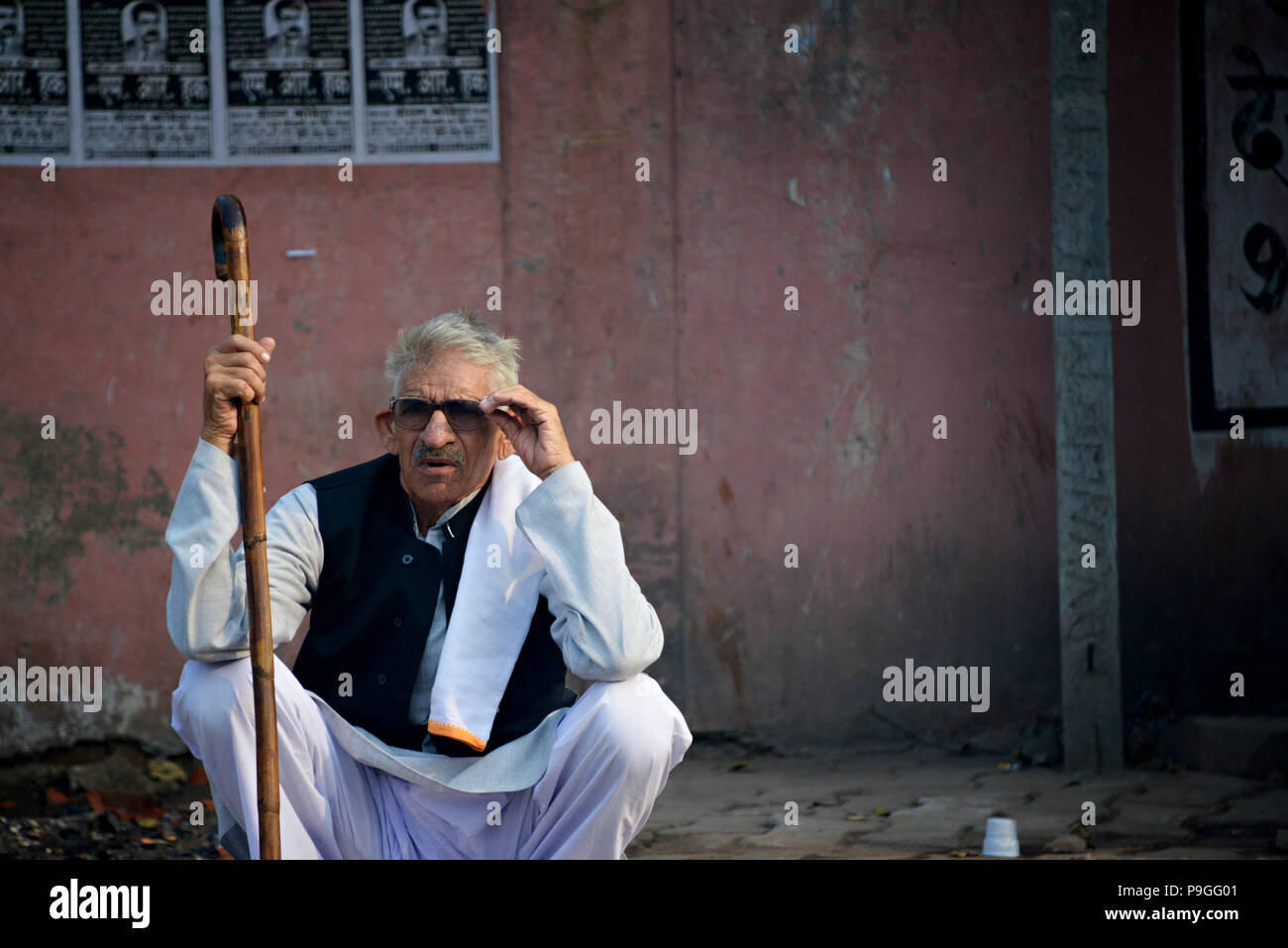 Old indian man walking stick hi-res stock photography and images - Alamy