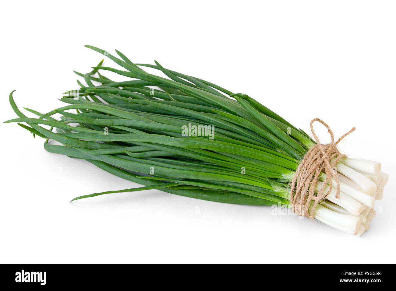 Bunch of chives on white background Stock Photo - Alamy