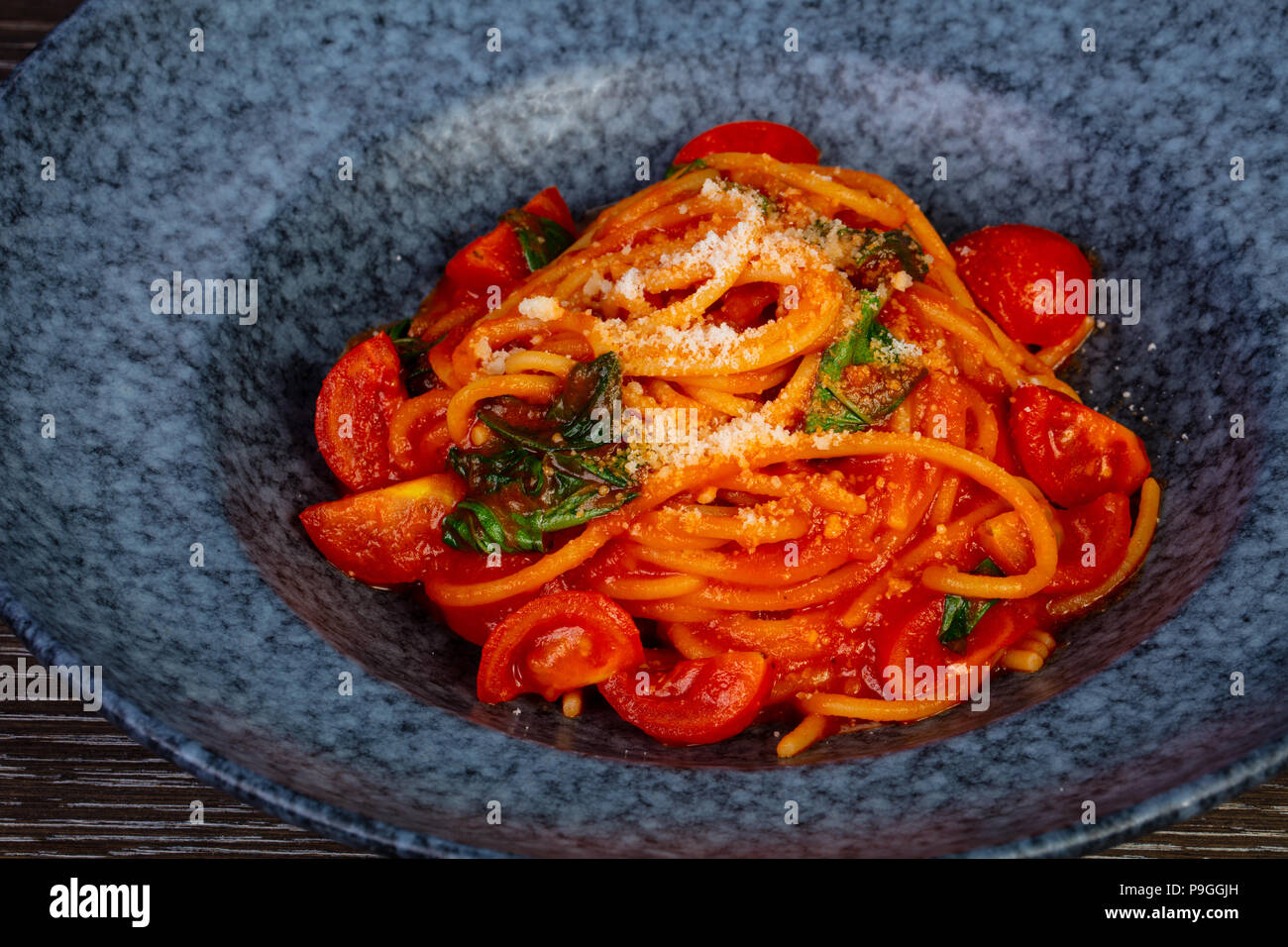 Red spaghetti with tomato,salt and basil Stock Photo - Alamy