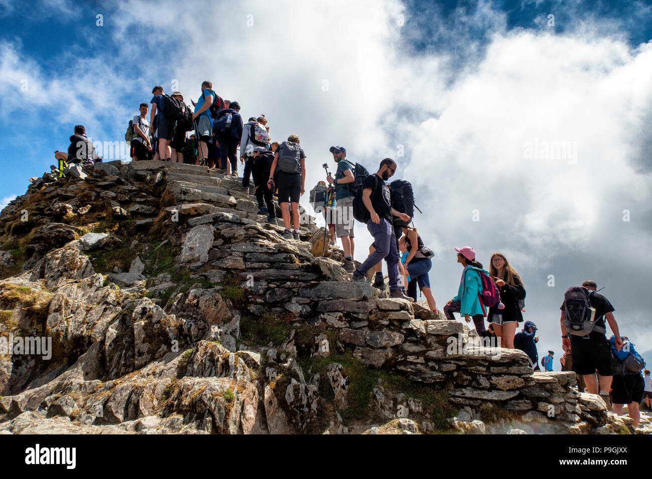 Walkers at the summit of mount snowdon in snowdonia hi-res stock ...