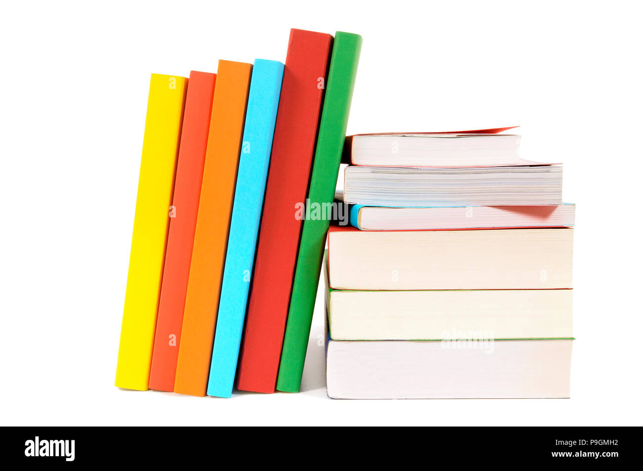 Small pile and leaning row of colorful books isolated on white Stock ...