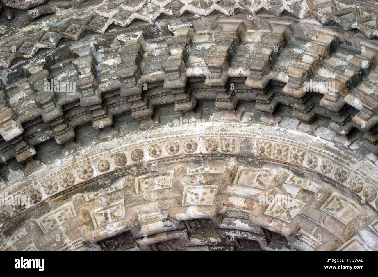 Detail carving decoration on an ancient stone arch Durham England Stock ...
