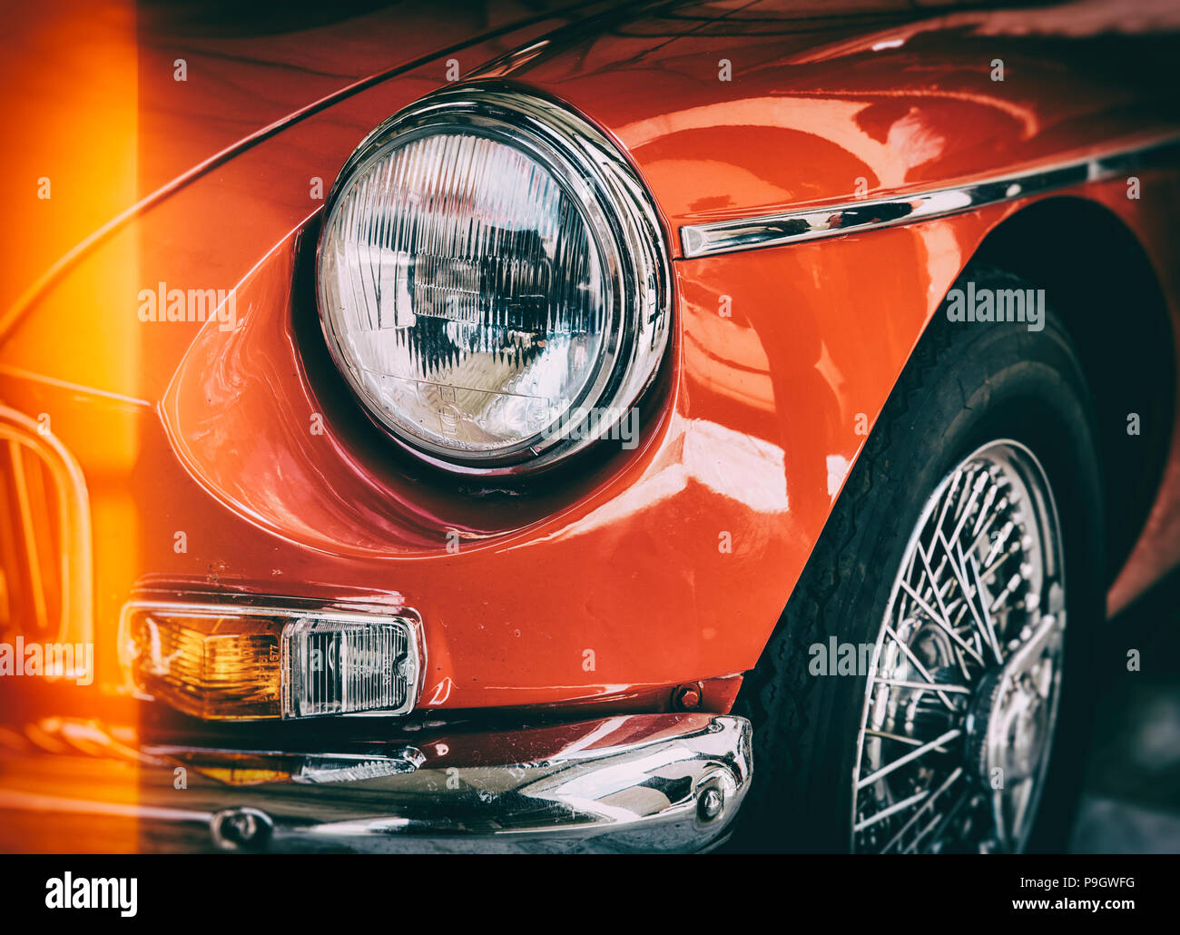 Front view of red shiny classic vintage car. Retro toned postcard ...