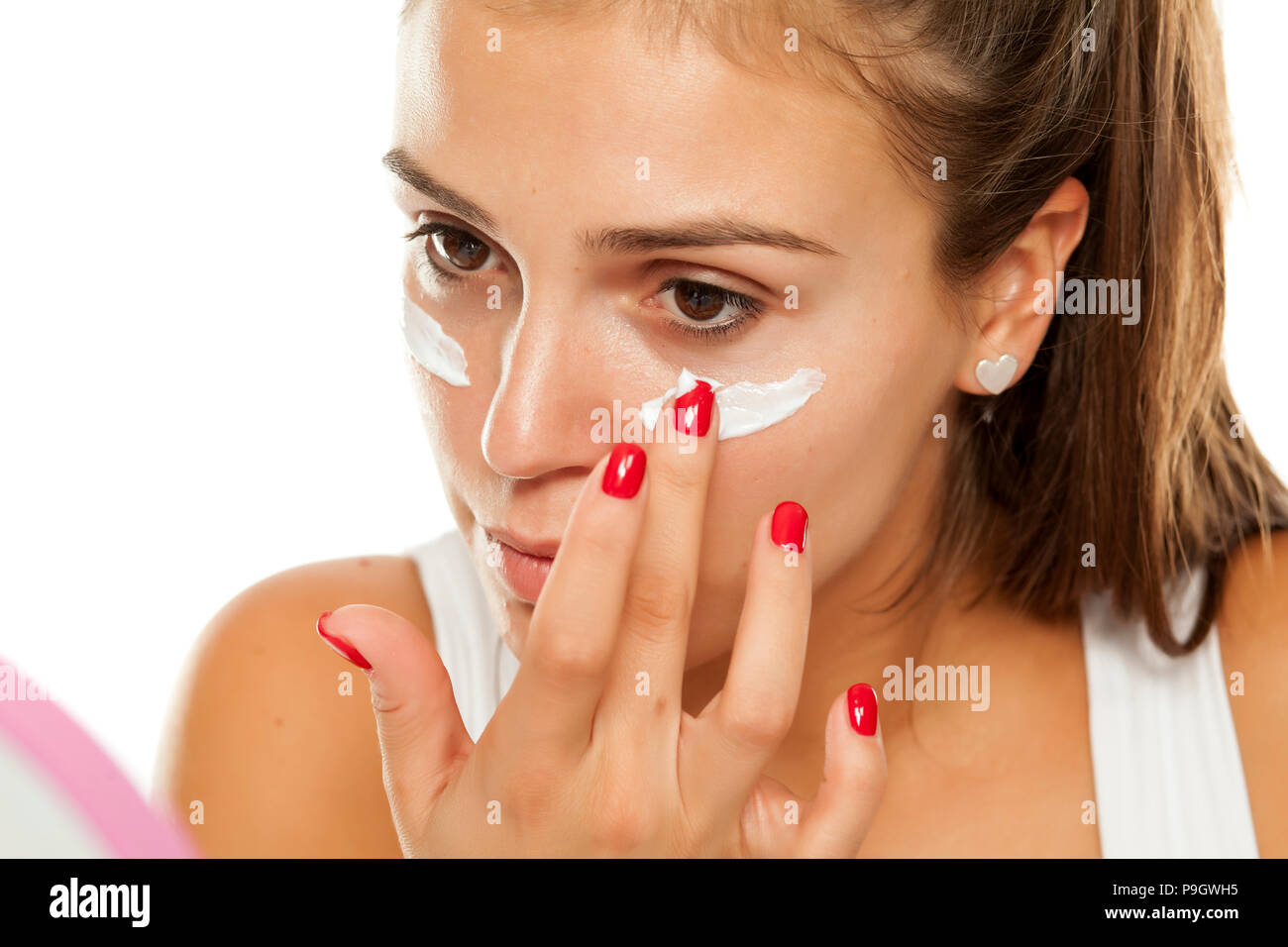 Applying creme skin hi-res stock photography and images - Alamy