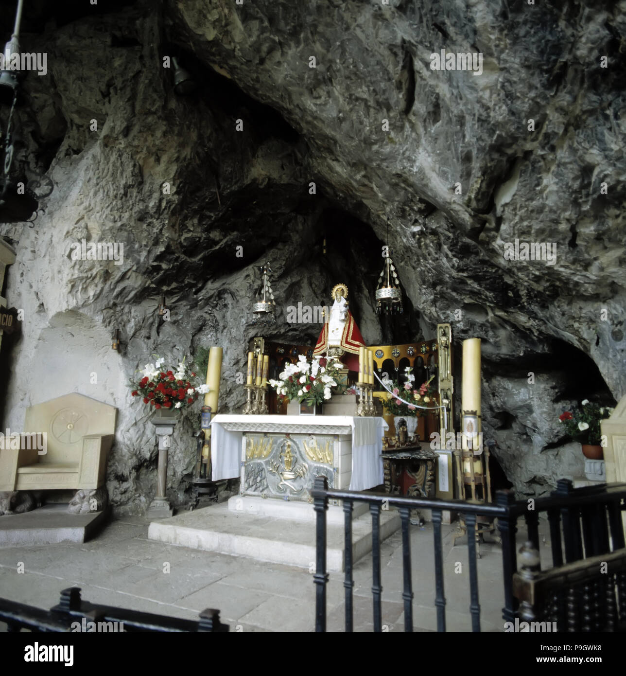 Interior of the Holy Cave of Covadonga with the image of the Virgin ...