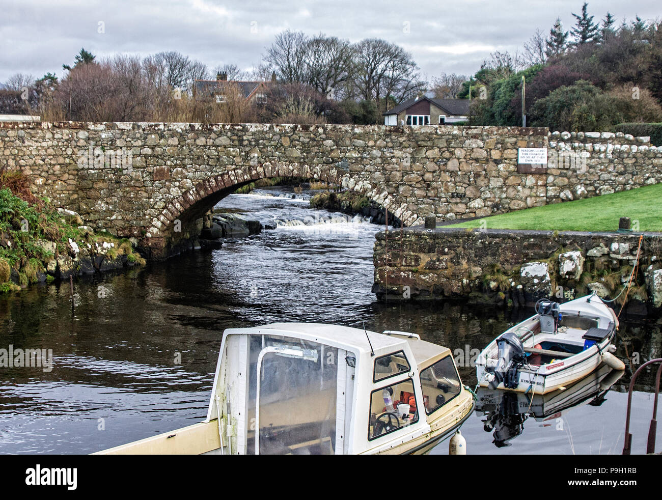 Boats in the harbour and bridge over the Black Water at Kinloch, Isle ...