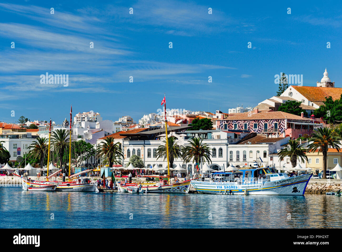 Lagos harbour with excursion yachts at the quayside Stock Photo - Alamy