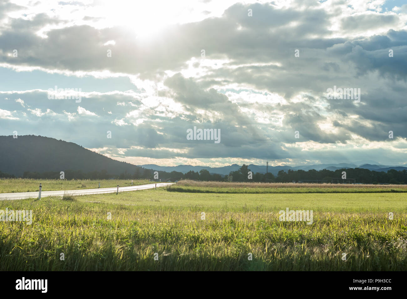 local road beautiful sunset Stock Photo - Alamy