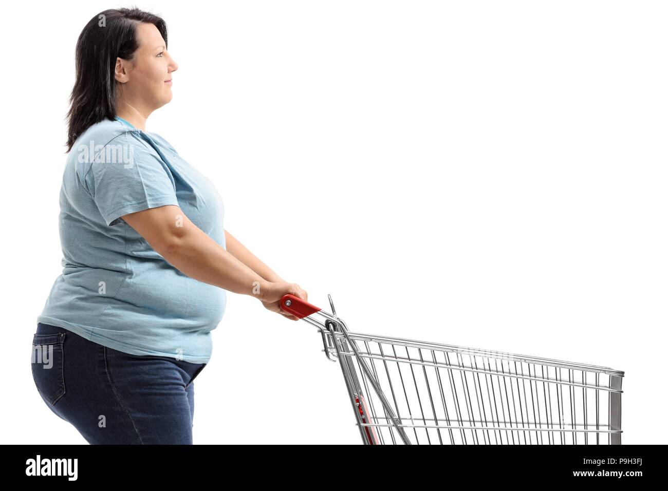 Woman pushing an empty shopping cart isolated on white background Stock ...