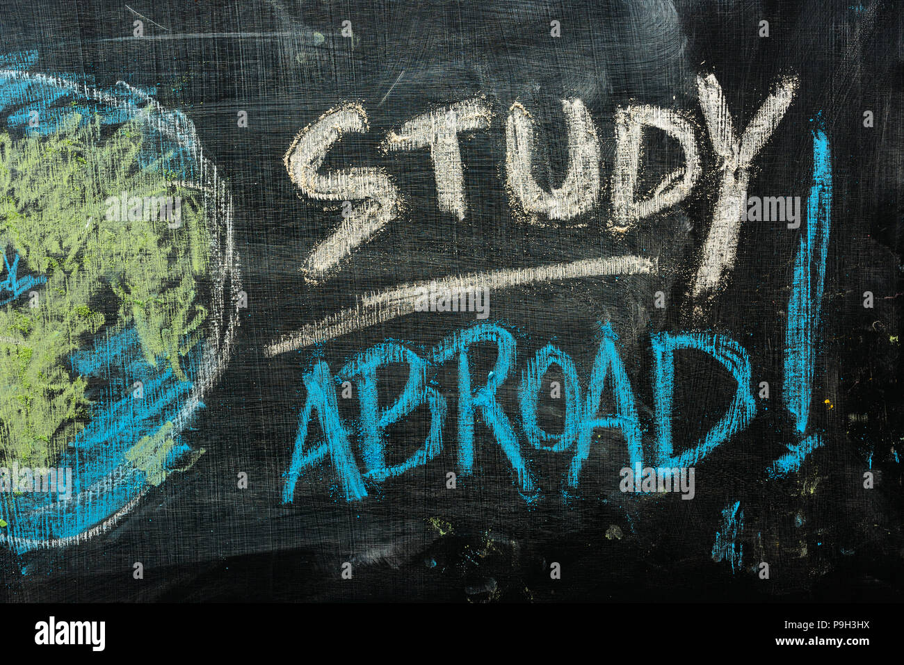 Study abroad concept with handwritten text in chalk on school ...