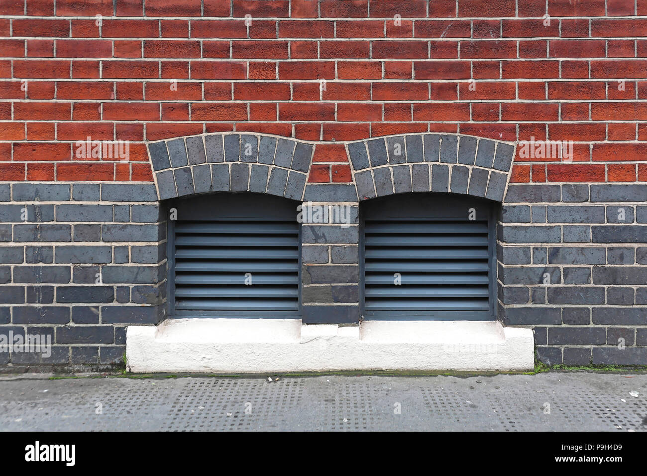 Two Ventilation Inlets at Brick Building Exterior Stock Photo - Alamy