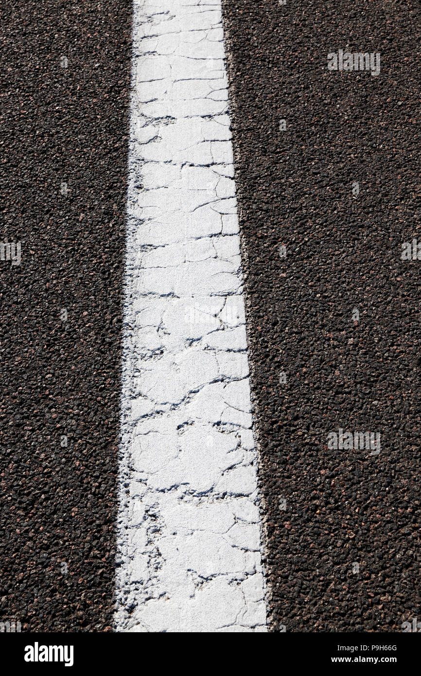 white strip of road markings on a new road, close-up photo Stock Photo ...