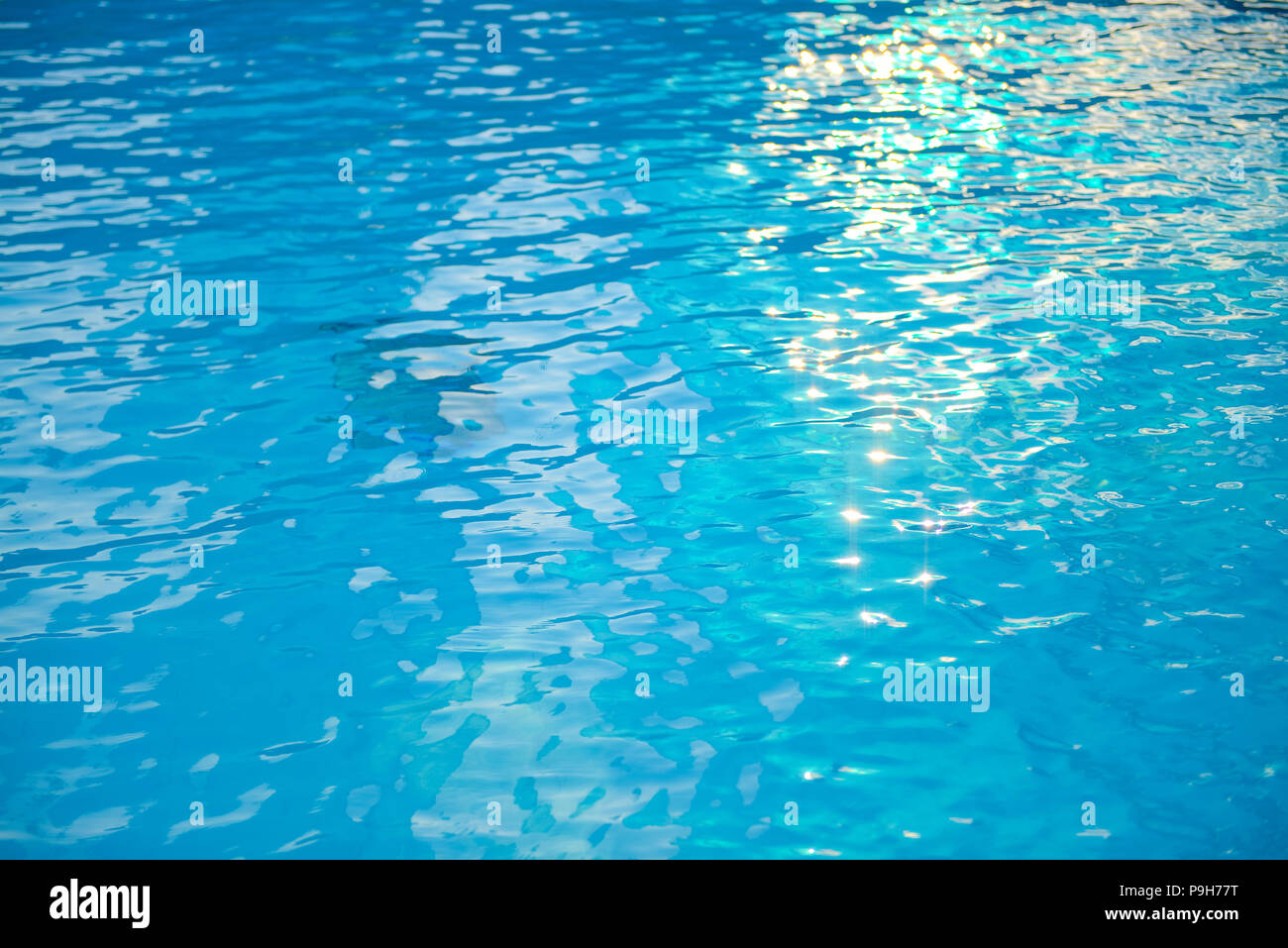 Soft focus bokeh light effects over a rippled, blue water background in the pool Stock Photo - Alamy