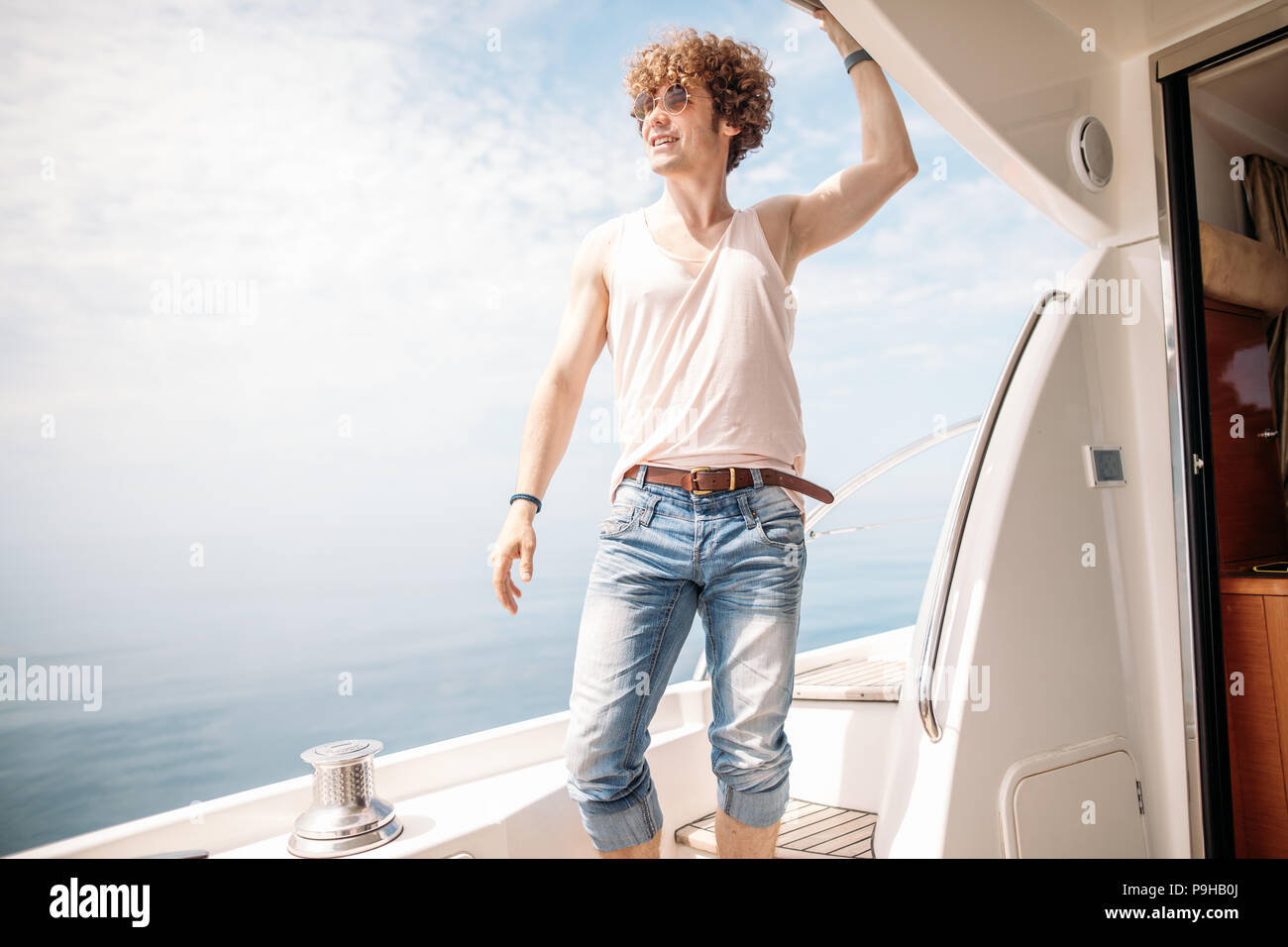 High angle shot of young handsome hipster sailor man hairs a sailing ...