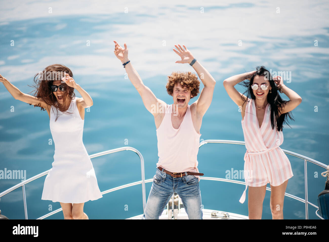 Young yoyful people having fun in boat party - Happy friends enjoying ...