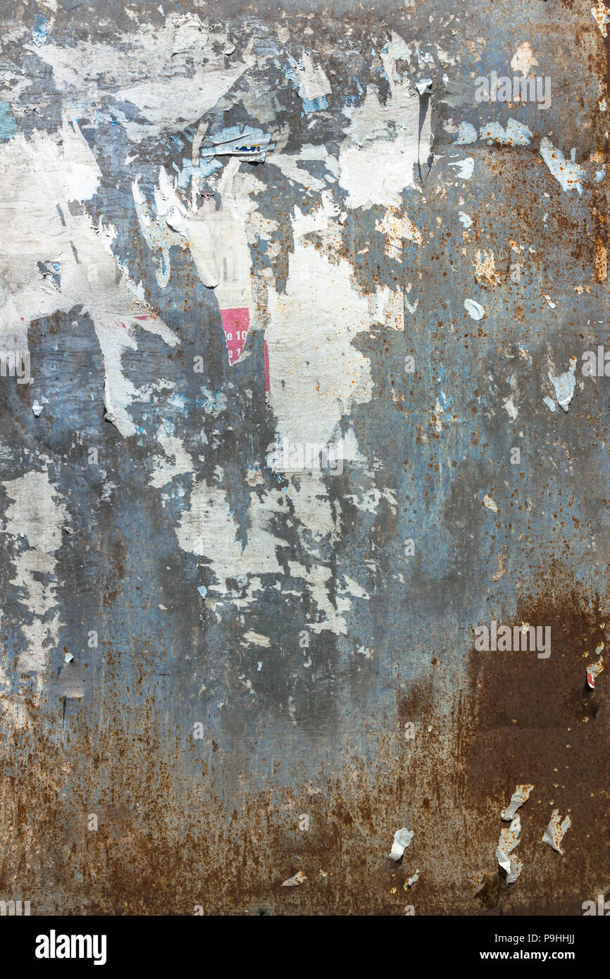 Texture of torn advertisement on an old rusty billboard panel. Ideal ...