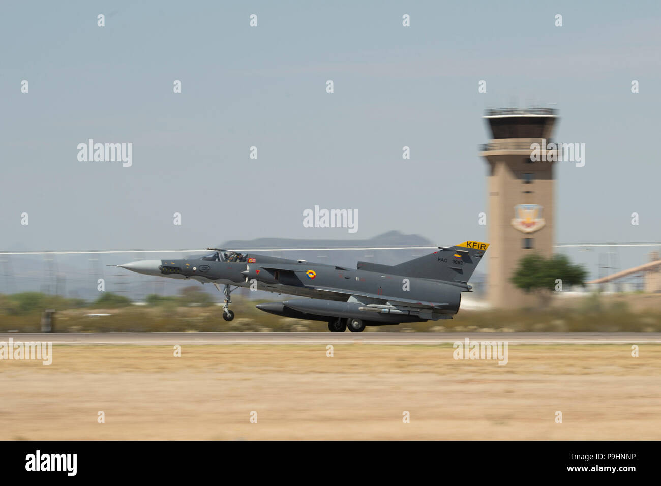 A Colombian Kfir fighter jet launches from the flightline at Davis ...