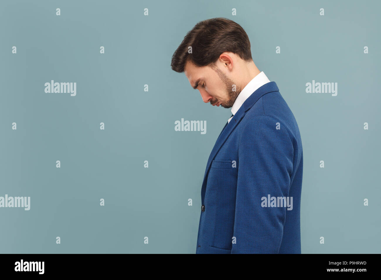 side view or profile view of sad, unhappy crying handsome bearded ...