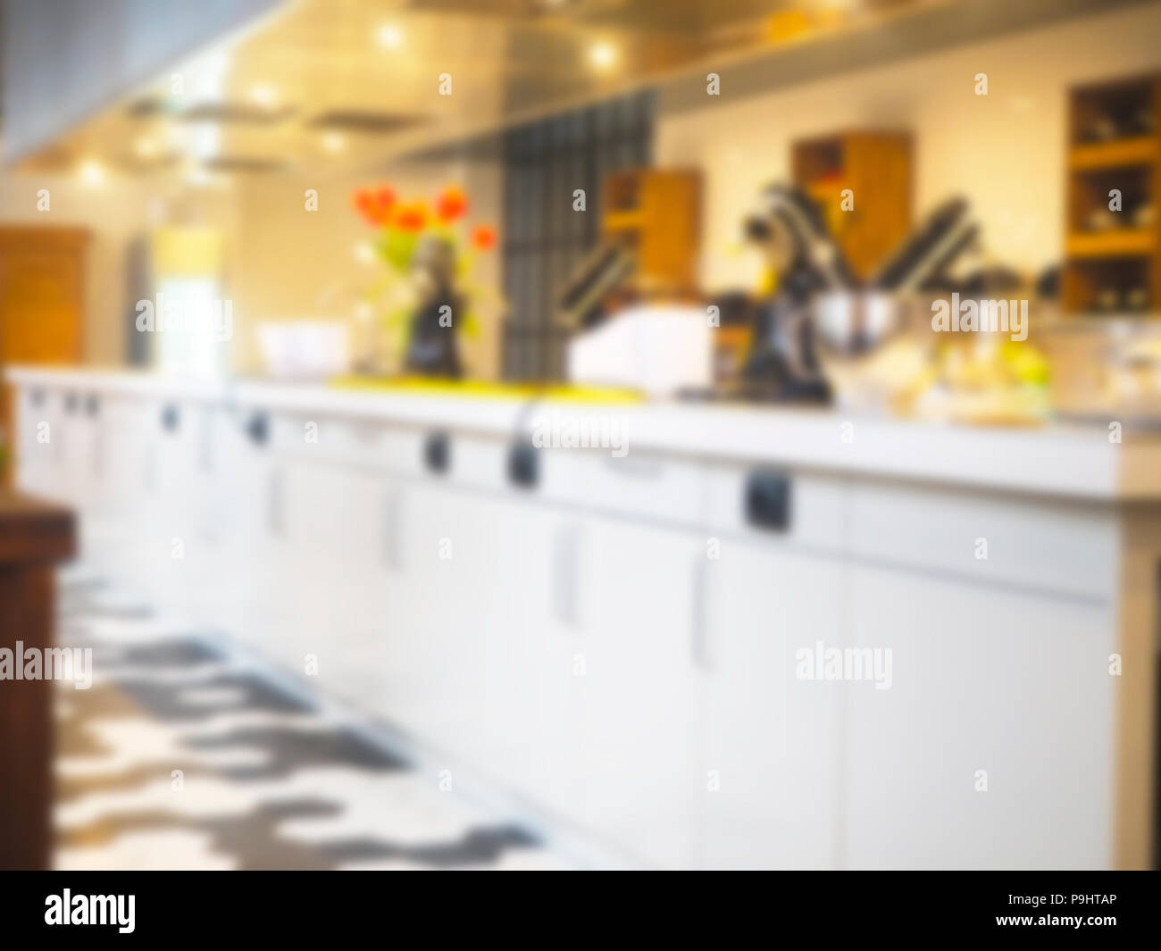 Blurred kitchen interior background with working place Stock Photo - Alamy