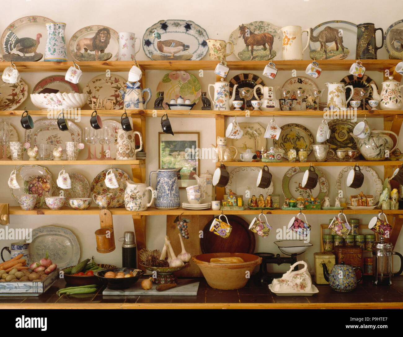 Collection of antique china on wooden shelves Stock Photo - Alamy