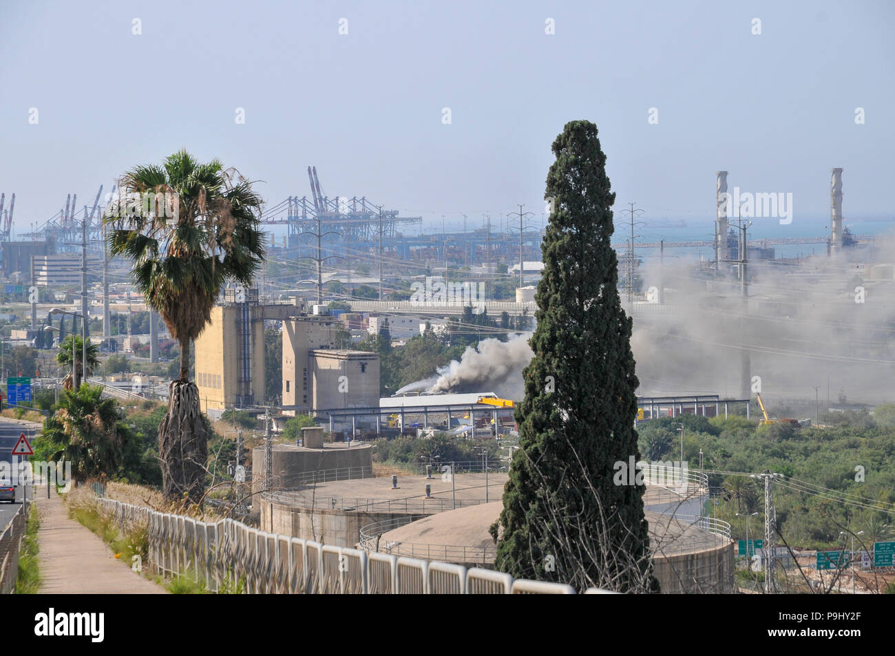 Heavy smoke is seen from a fire in the Haifa recycling facility. Haifa ...