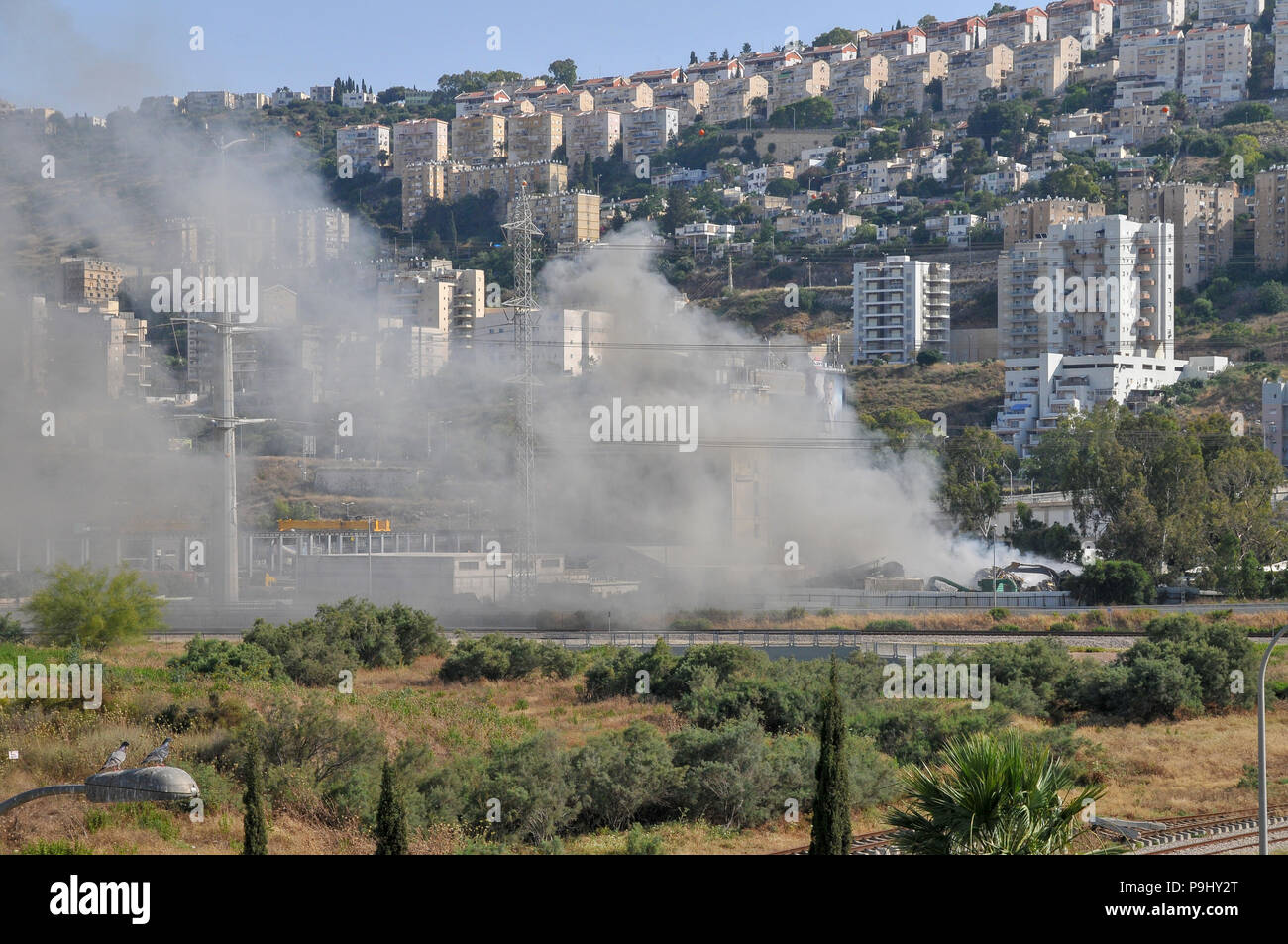 Heavy smoke is seen from a fire in the Haifa recycling facility. Haifa ...