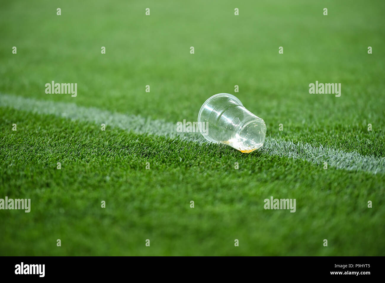 Plastic trash can on the turf on a soccer field Stock Photo - Alamy