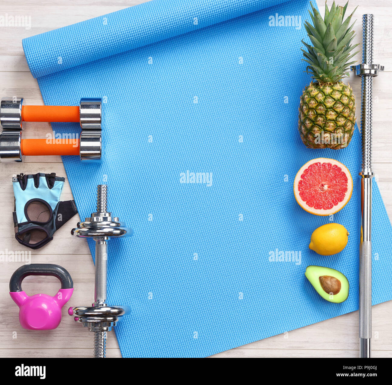 Sports equipment and healthy food on a white wooden background. Top ...