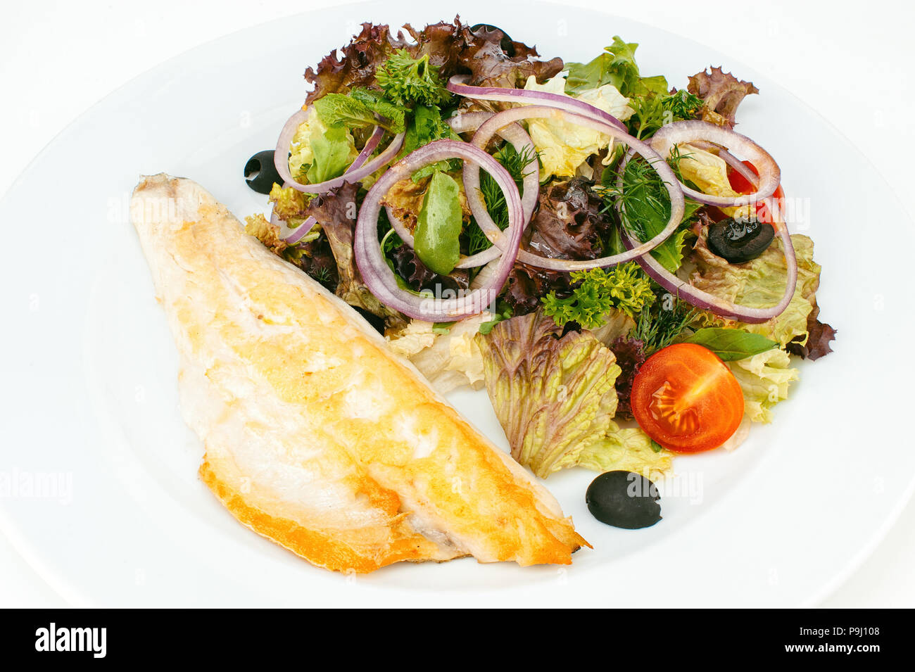 Roasted whitefish fillet with mixed fresh salad isolated on white ...