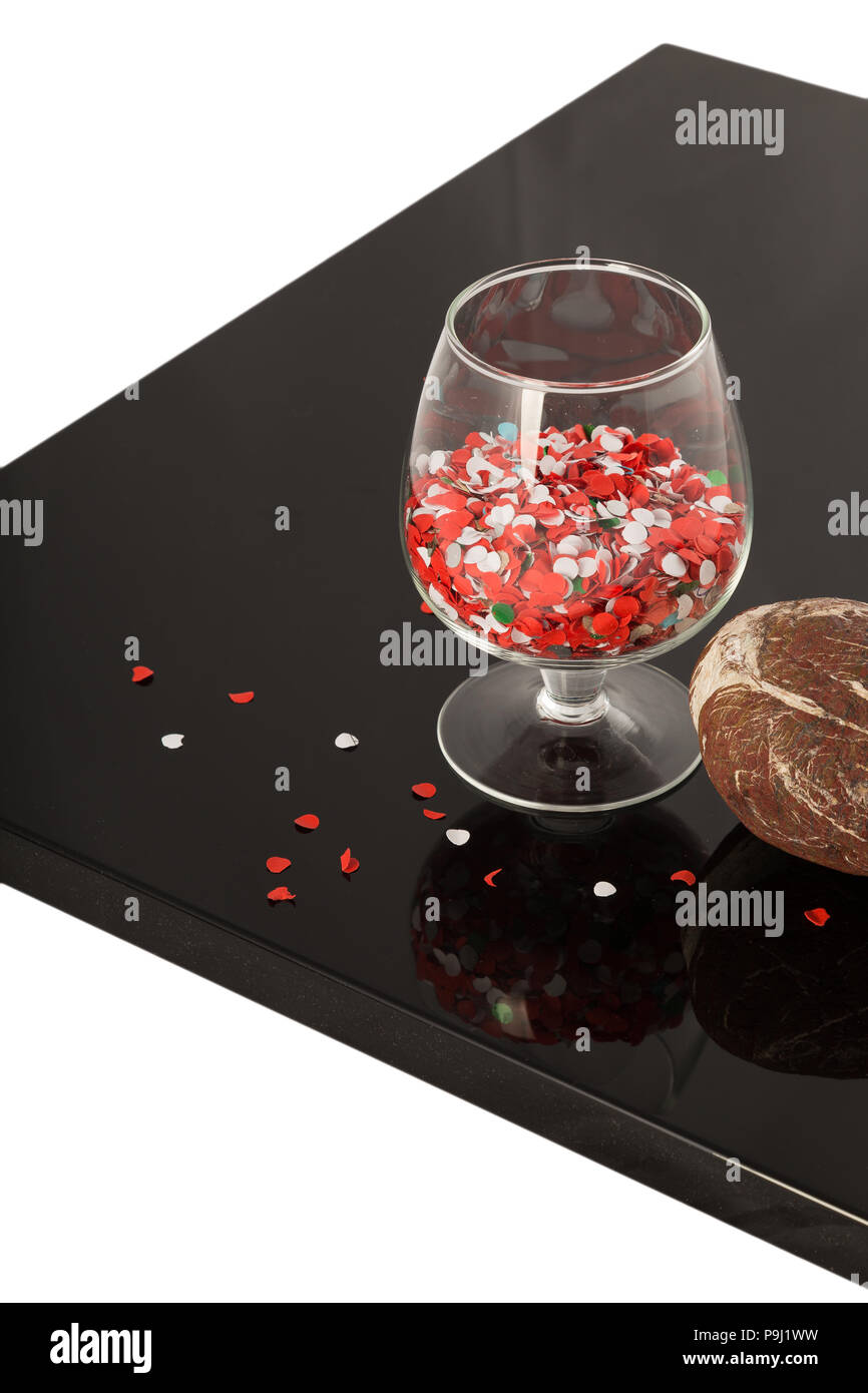 Natural stone and a glass on the varnished coating, the reflection of ...