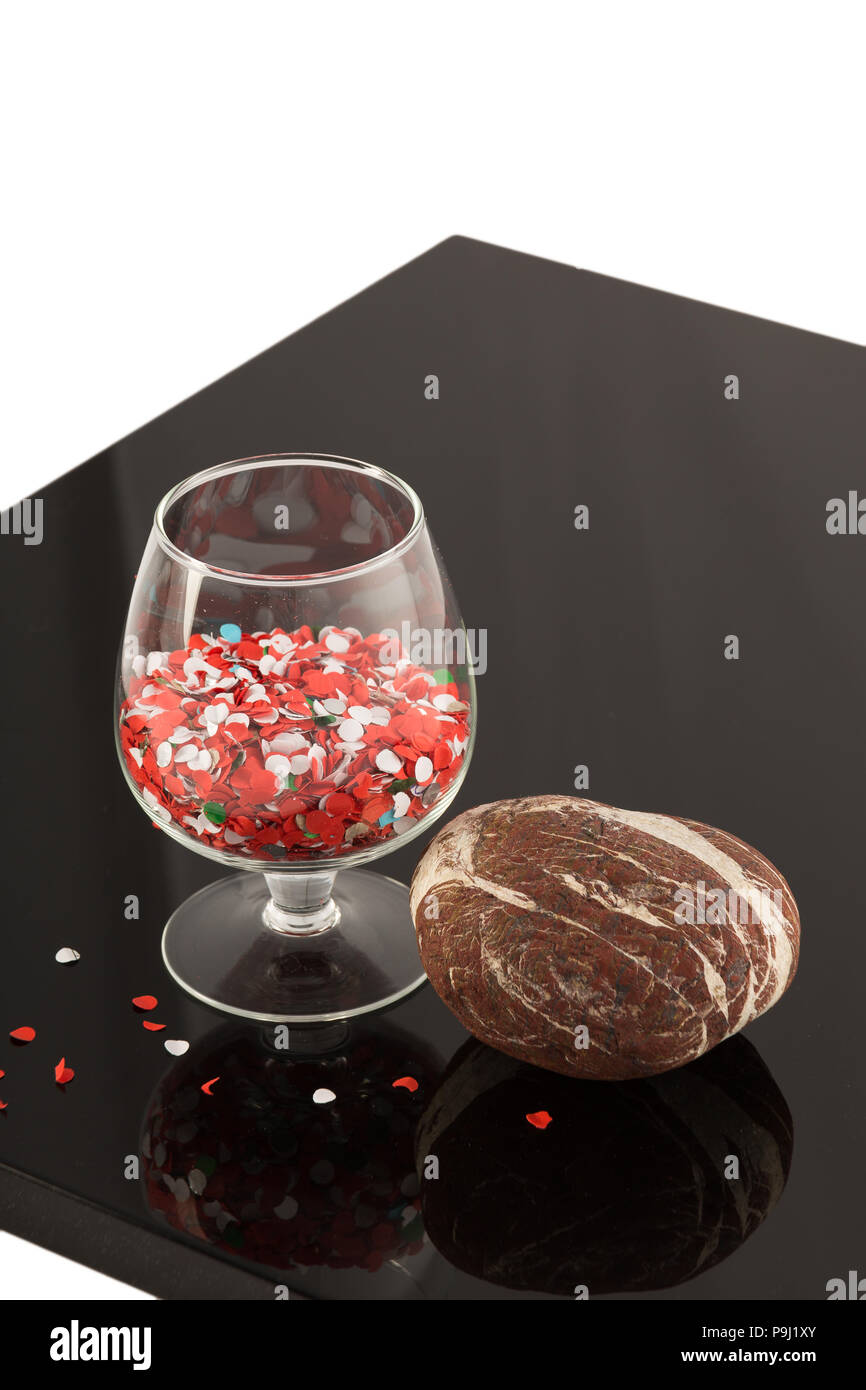 Natural stone and a glass on the varnished coating, the reflection of ...