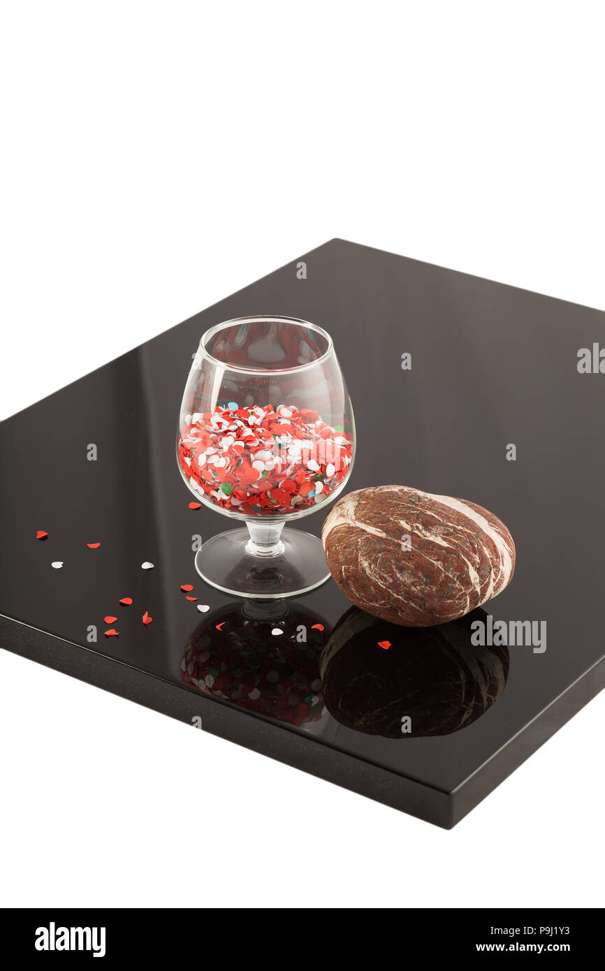 Natural stone and a glass on the varnished coating, the reflection of ...