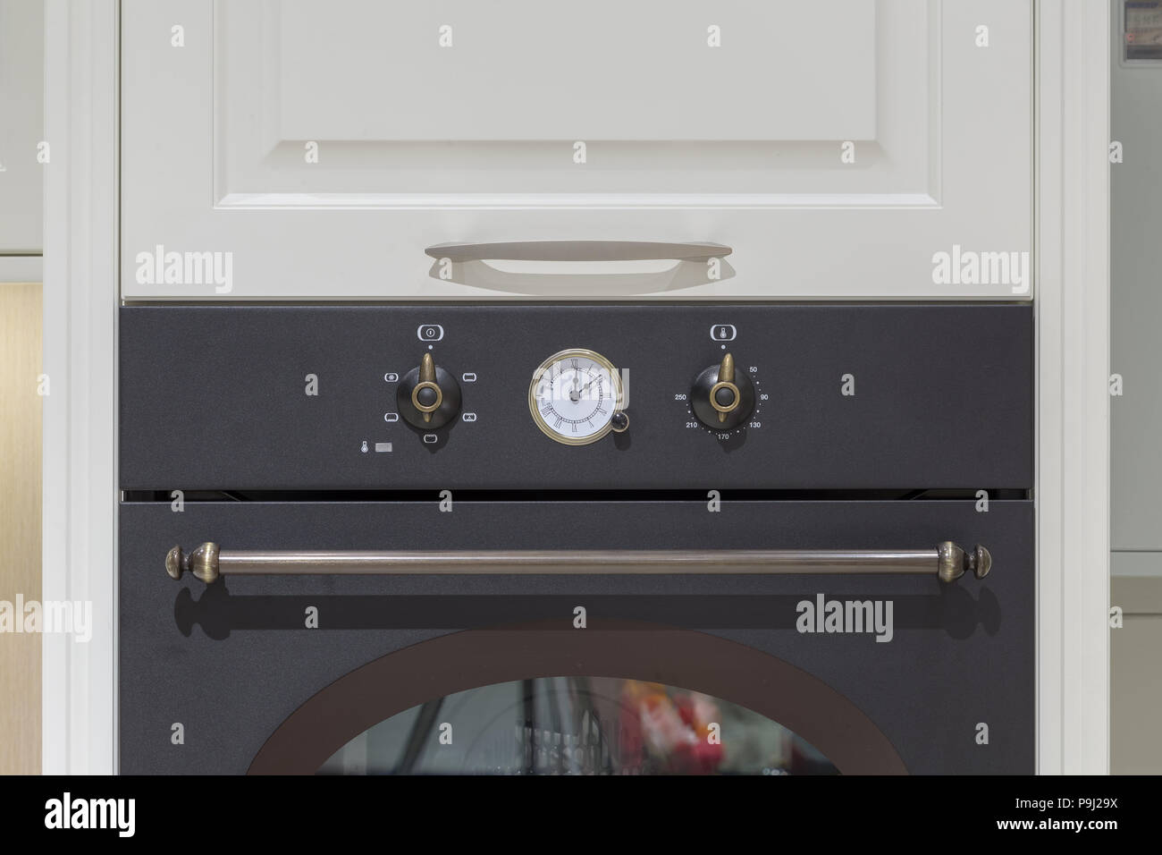 Oven panel close-up, regulators and placard for information Stock Photo ...