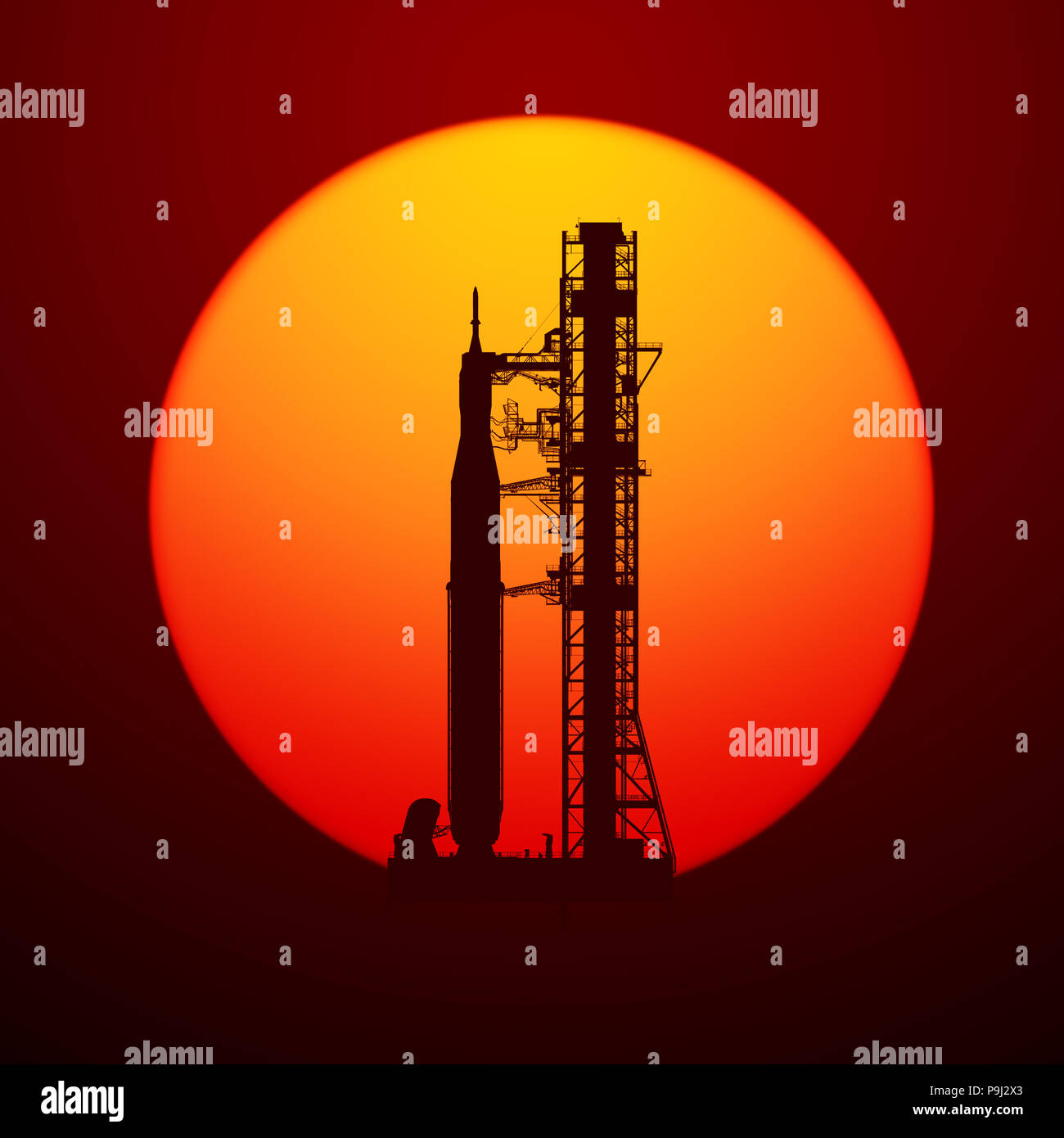 Space Launch System On Launchpad Over Background Of Red Sun. 3D ...