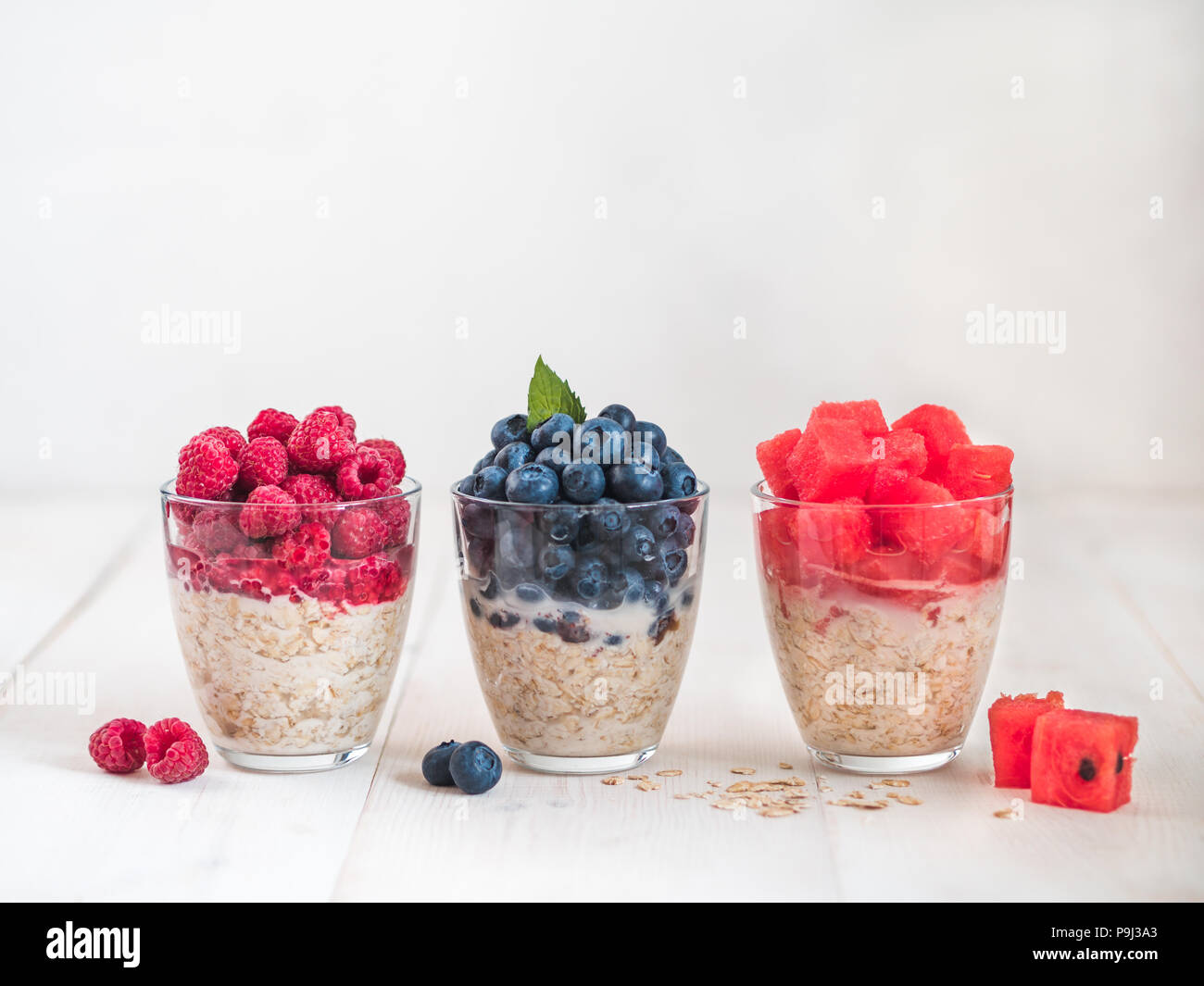 Healthy breakfast: overnight oats with fresh fruits and berries in ...