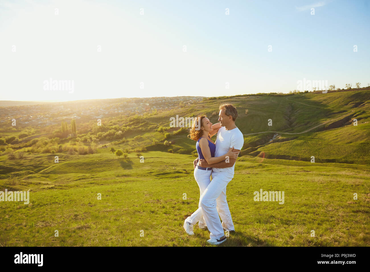 Romantic couple at sunset on outdoor hi-res stock photography and ...
