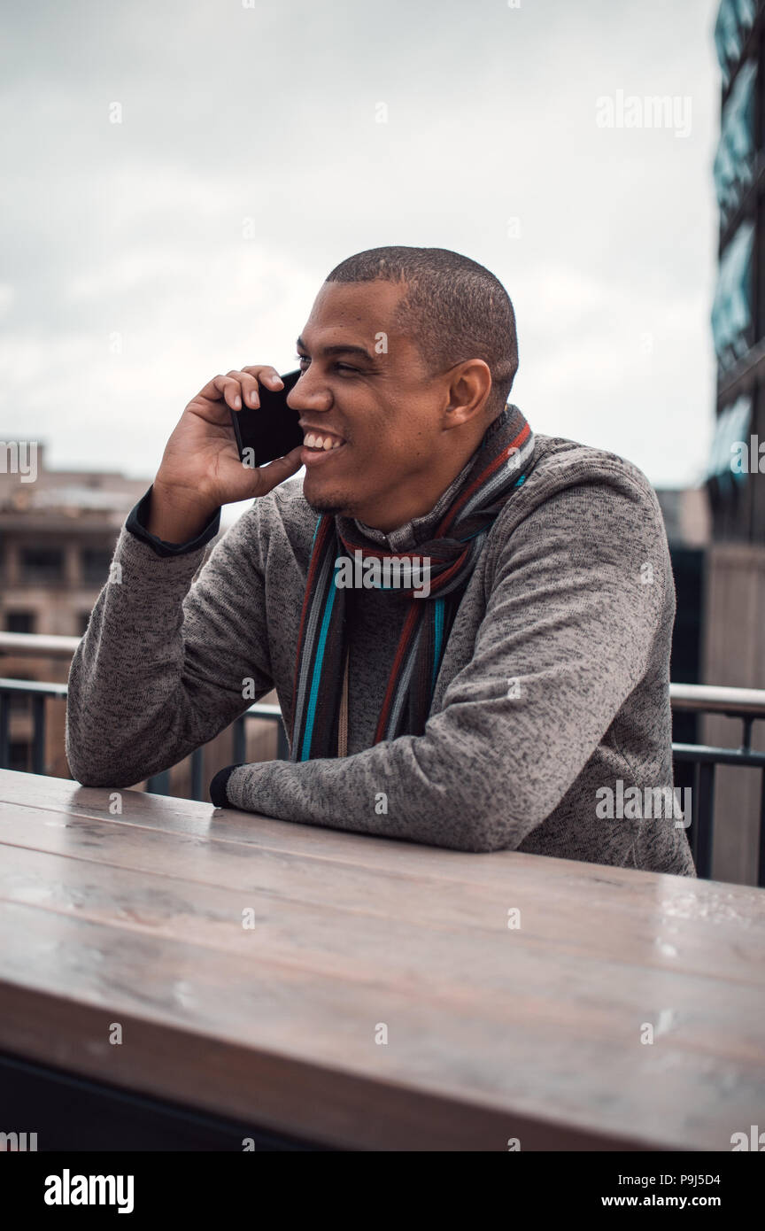 Mid adult businessman listening hi-res stock photography and images - Alamy