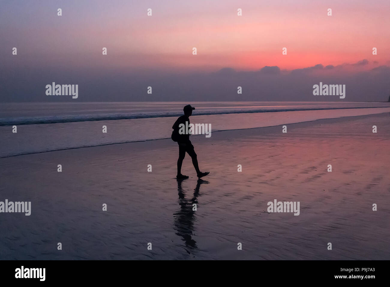 Amazing sea sunset with reflection. Solitary man. A colorful sunset sea ...