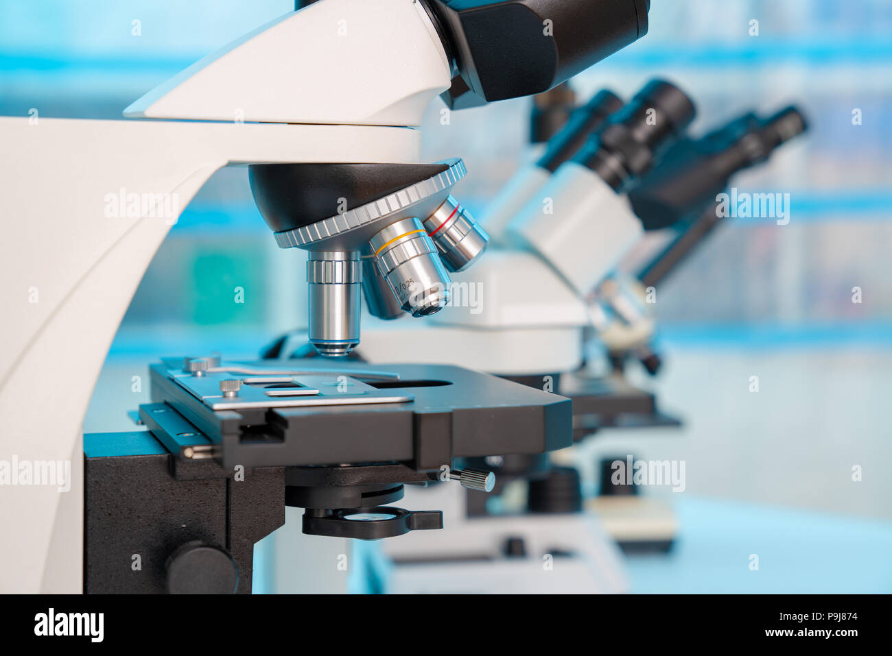 Four microscopes of different designs in the laboratory Stock Photo - Alamy