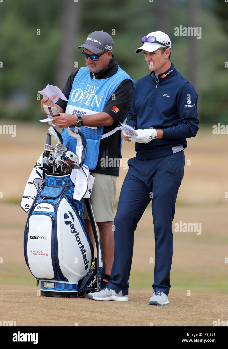England's Justin Rose with his caddie during preview day four of The ...