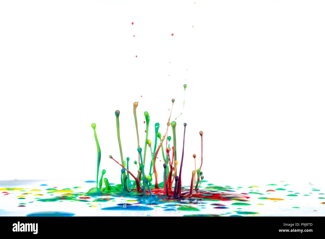Isolated shot of paint splashing on white Stock Photo - Alamy