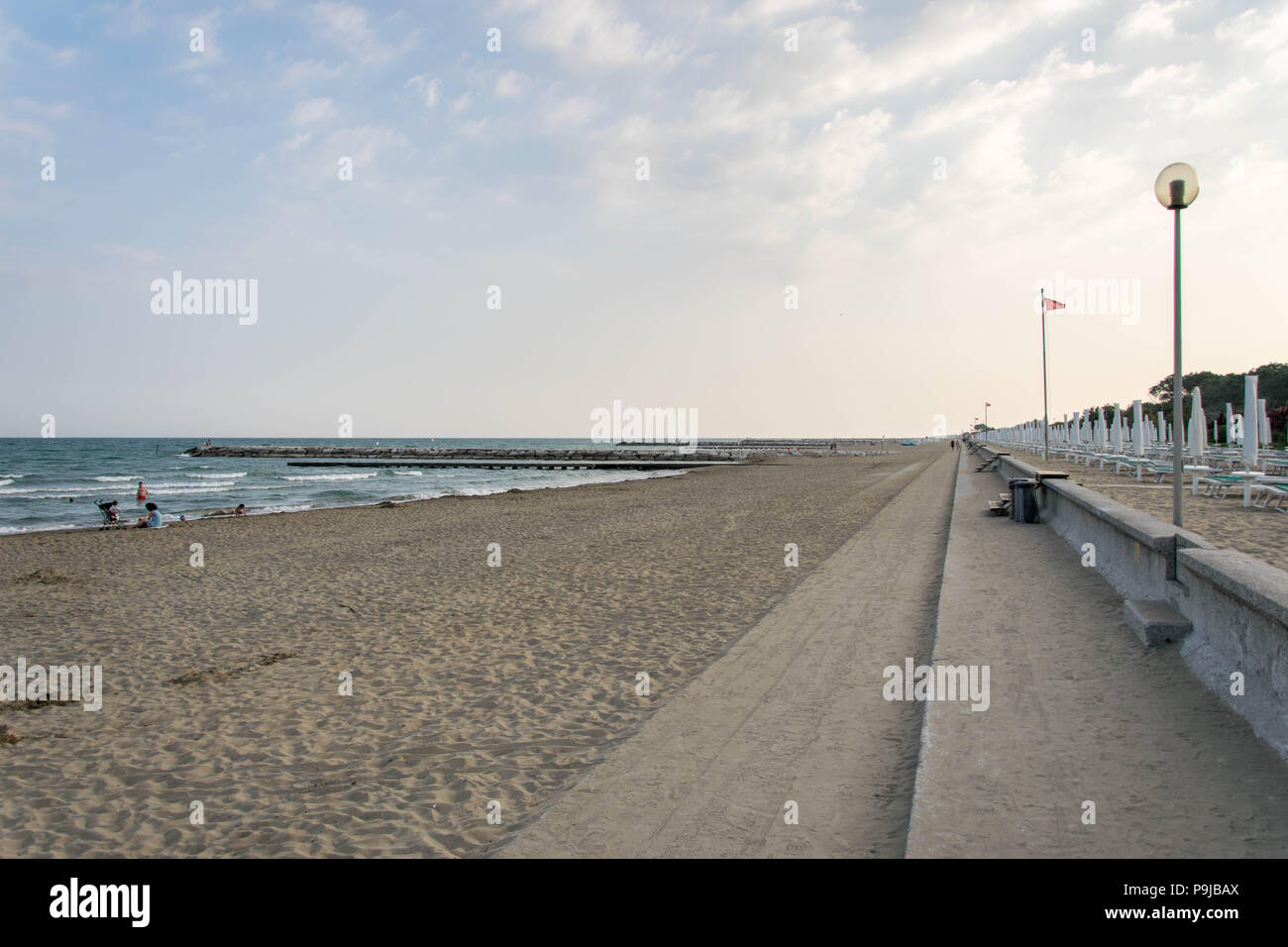 Europe, Italy, Veneto, Caorle. Evening time at the beach. Lido Altanea ...