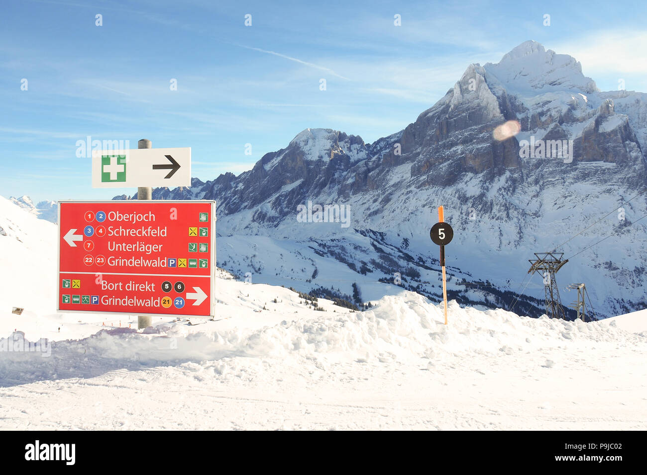 Road signs for skiers on the slopes of Grindelwald First in Switzerland ...
