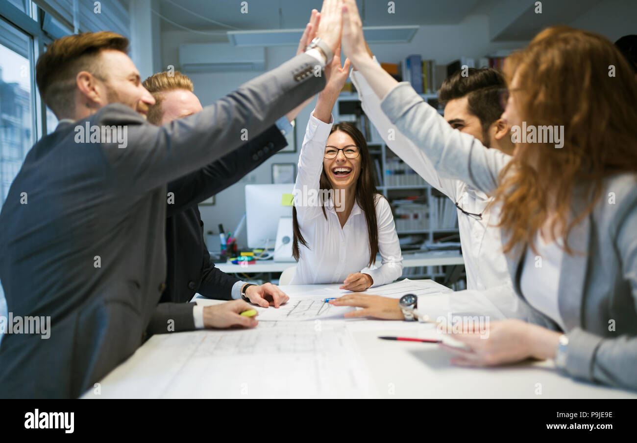 Happy business people celebrating success Stock Photo - Alamy