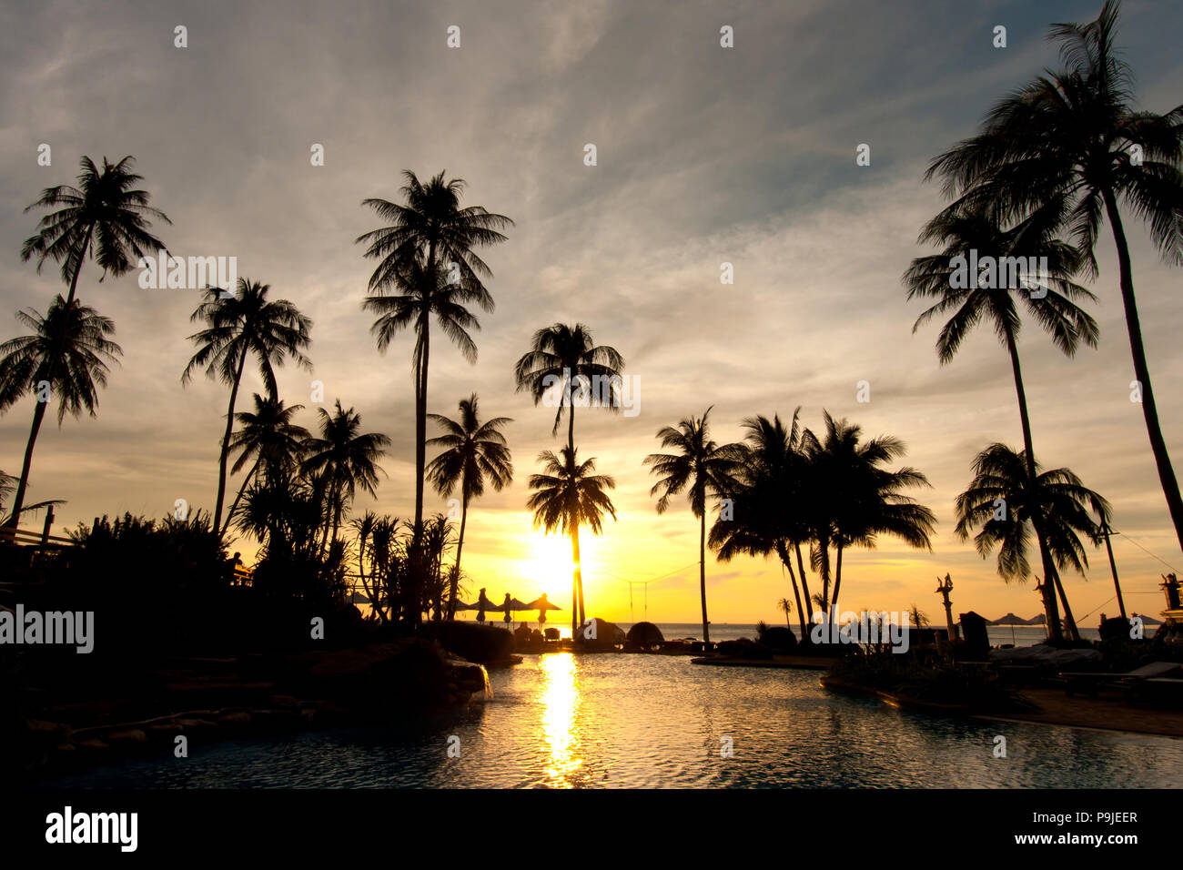 Beautiful sunset at a beach resort Stock Photo - Alamy