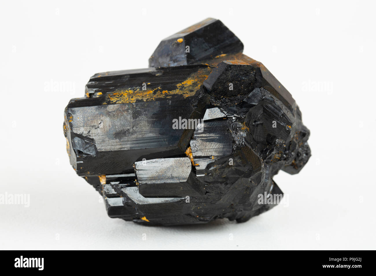 Extreme close up of black tourmaline mineral isolated over white ...