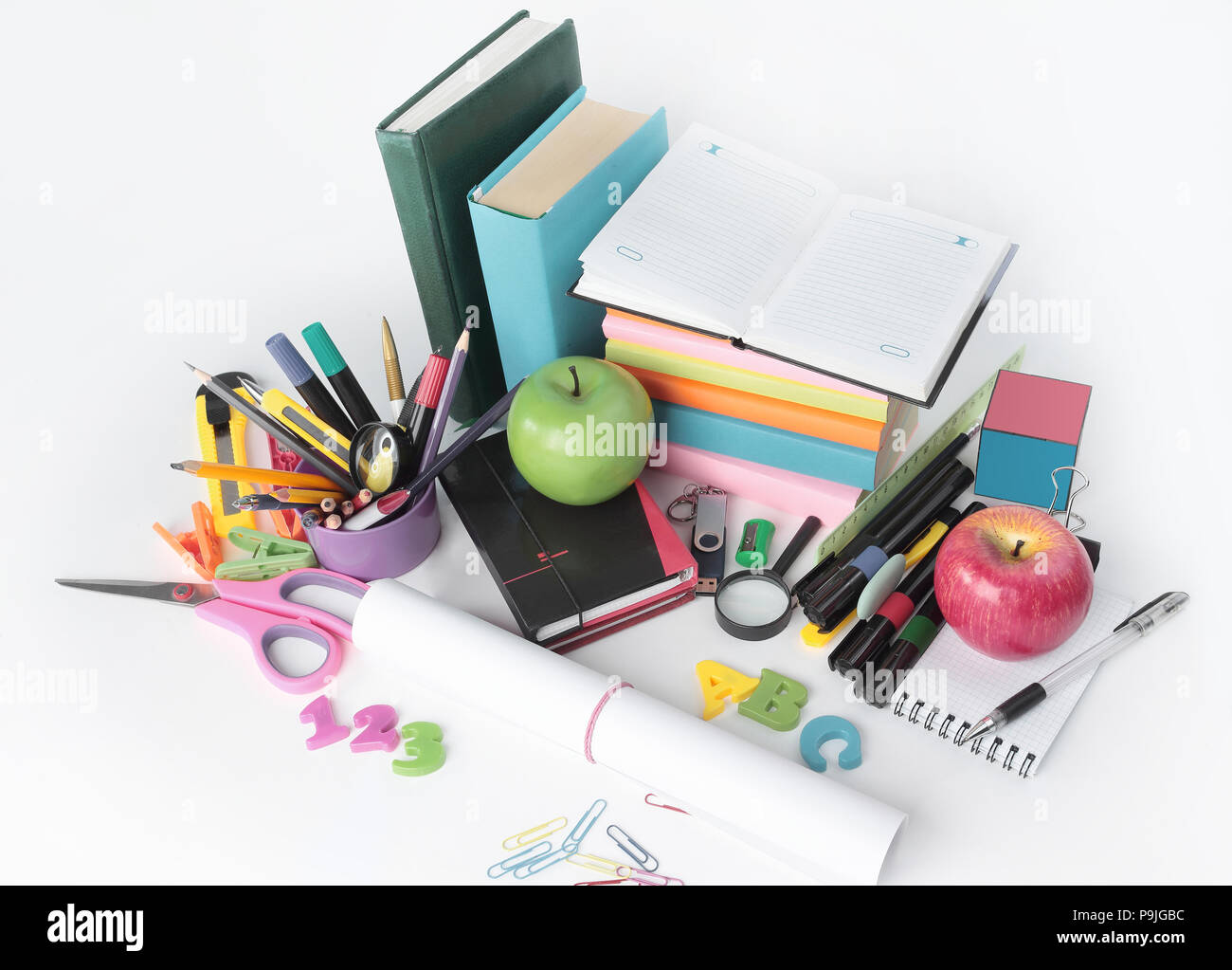 close up.a sheet of drawing paper and school supplies isolated on white ...