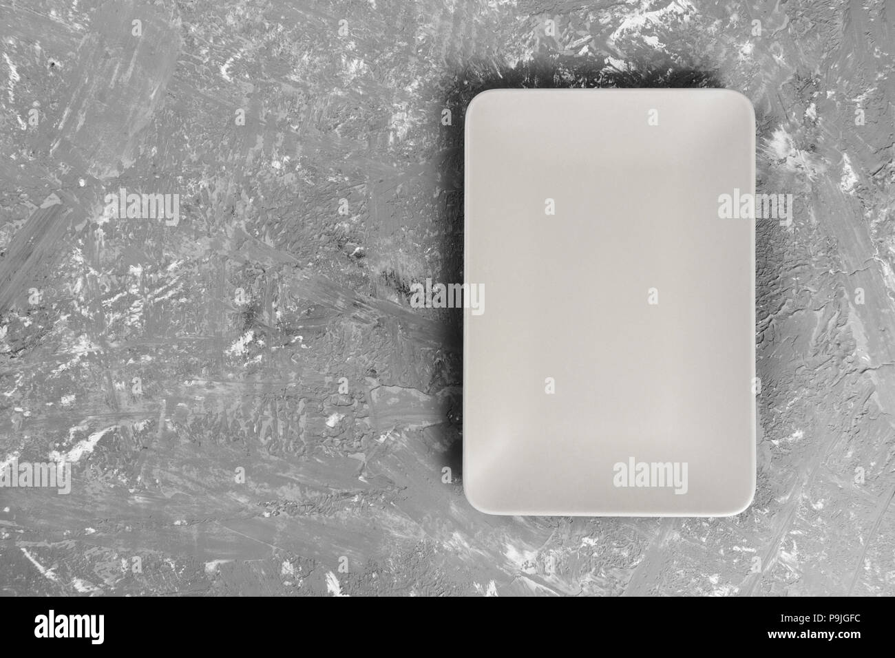 Top view of matte rectangular empty plate on dark background Stock ...