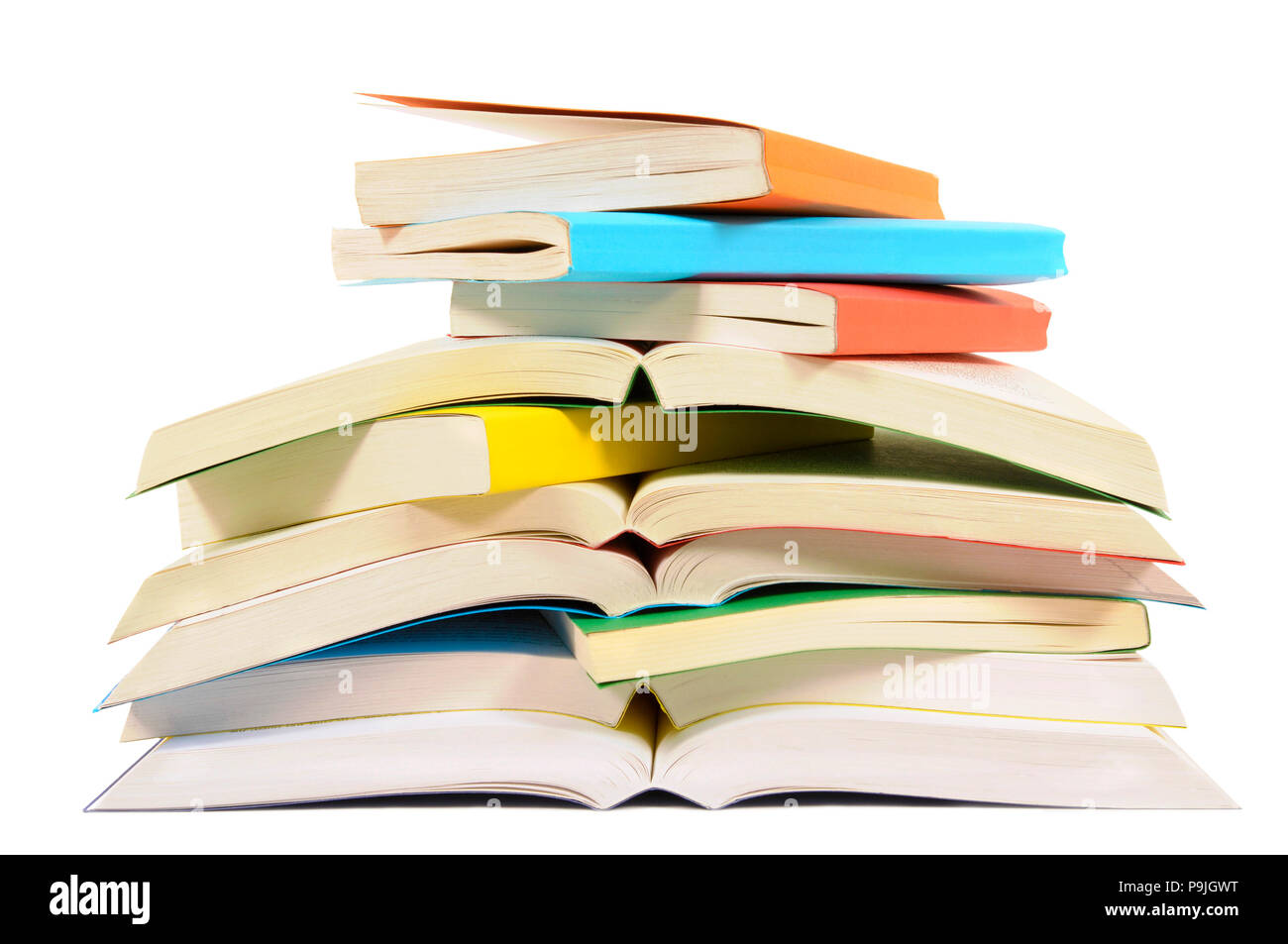 Closeup untidy small pile of paperback books isolated on white ...