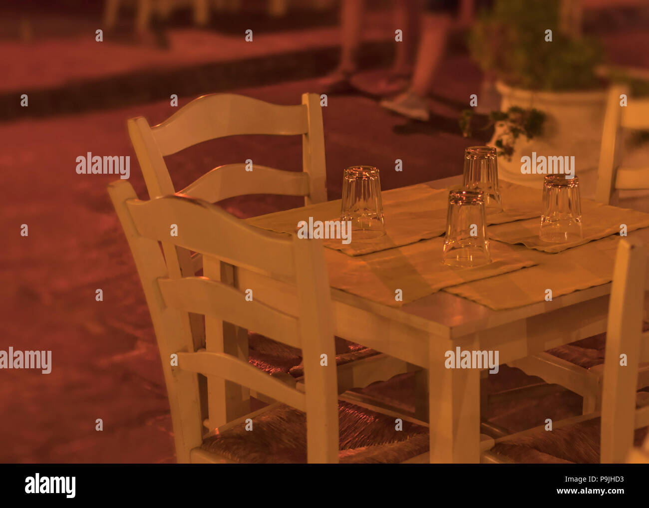 White restaurant table for four with candle outside on terrace Stock ...